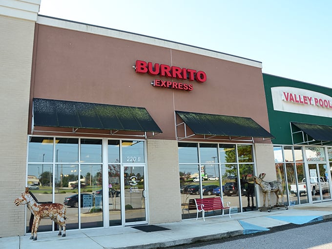 The unassuming storefront of Burrito Express, complete with wooden donkey sentinel, proves that culinary treasures often hide in plain sight.