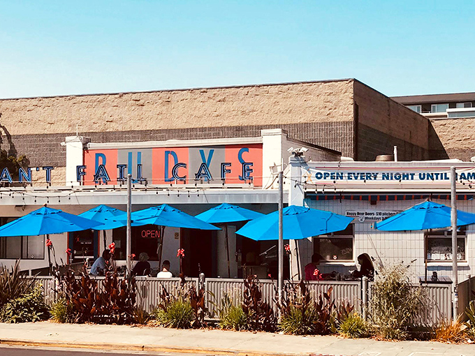 The unassuming exterior of Rudy's Can't Fail Cafe proves that culinary treasures often hide in plain sight. Classic diner architecture with a punk rock attitude.