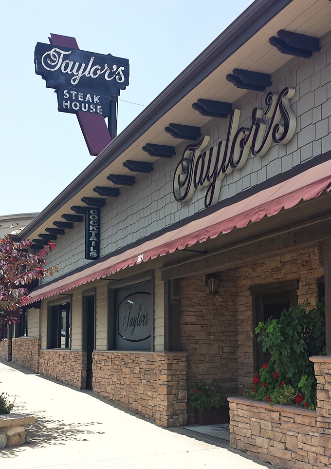 The iconic Taylor's sign beckons meat lovers like a lighthouse guiding hungry sailors home. Classic stone facade and vintage charm promise authentic steakhouse experience.