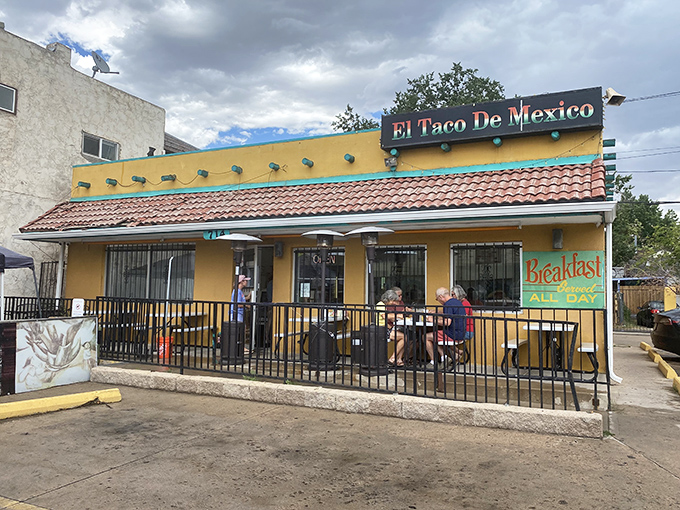 The little yellow building that launched a thousand road trips. El Taco de Mexico's vibrant exterior promises authentic delights within.