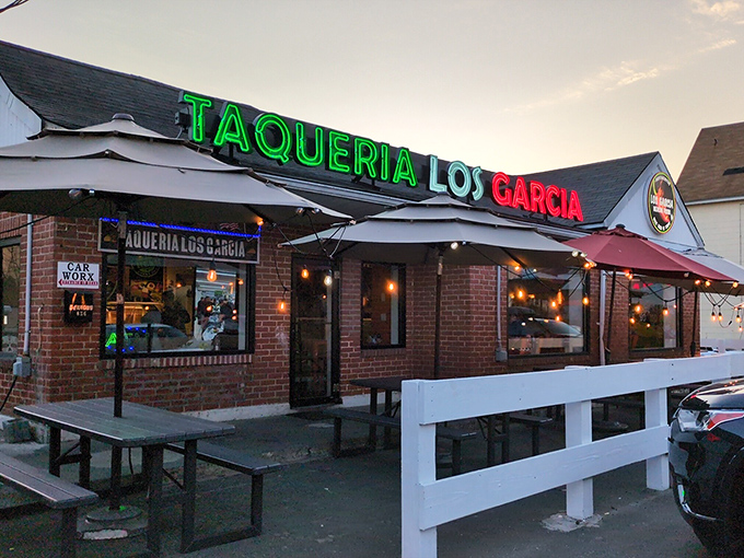 The colorful exterior of Los Garcia beckons hungry patrons with its vibrant sugar skull artwork and Mexican flag colors. Worth the wait in any weather!