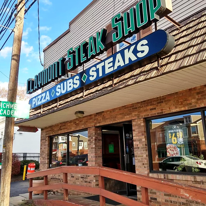 The unassuming brick fa&ccedil;ade of Claymont Steak Shop stands like a culinary lighthouse, beckoning hungry travelers with its no-nonsense promise of "PIZZA &bull; SUBS &bull; STEAKS."