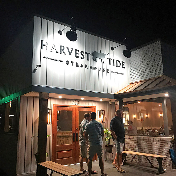 The sign beckons like a lighthouse for hungry souls. At night, Harvest Tide transforms from restaurant to culinary destination worth the pilgrimage.