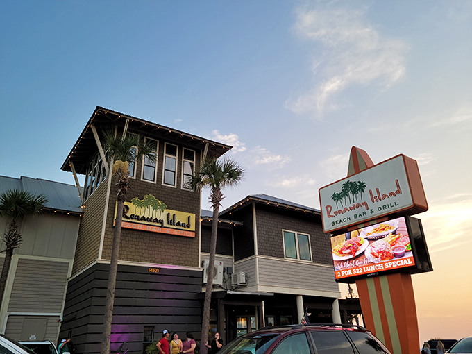 Coastal charm meets beachfront dining at Runaway Island, where the weathered wood exterior promises authentic Florida flavors with unbeatable Gulf views.