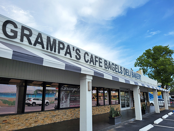 The promised land of carbs beckons with its classic striped awning. Grampa's exterior might be humble, but those full parking spaces tell the real story.