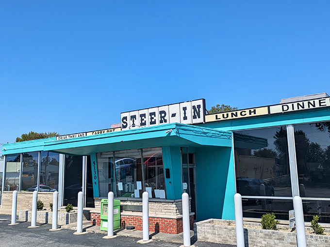 The iconic turquoise exterior of Steer-In beckons hungry travelers like a culinary lighthouse on Indianapolis's east side. That cartoon steer in a chef's hat knows what's up.