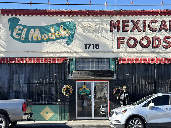 The unassuming exterior of El Modelo stands like a culinary lighthouse in Albuquerque's Barelas neighborhood, beckoning hungry pilgrims with its iconic Zia symbol.