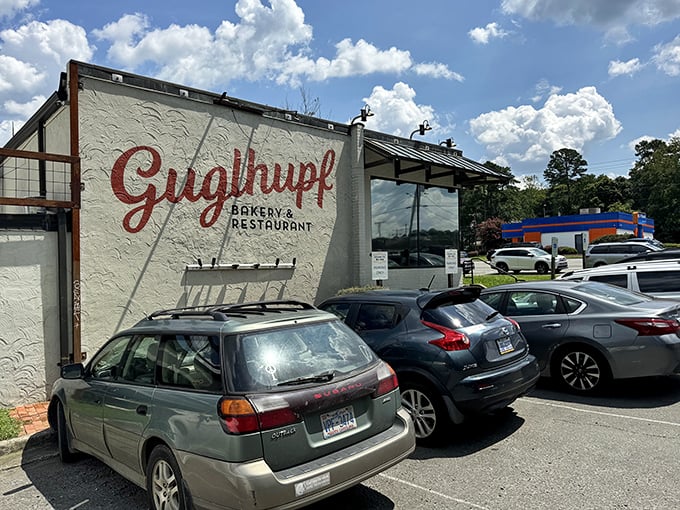A slice of Bavaria in Durham! This charming outdoor patio is where lederhosen meets Southern hospitality, complete with red umbrellas that pop like cherry tomatoes in a garden salad.