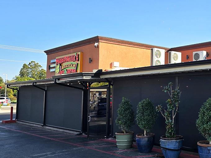 The bright yellow exterior of Tarahumara's stands like a beacon of culinary promise in Norman, beckoning hungry travelers with its distinctive signage and welcoming patio.