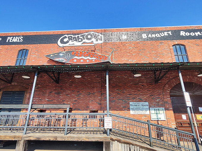 The brick facade and vintage neon sign of Pearl's Crabtown stand as a beacon for seafood lovers in landlocked Oklahoma City. Maritime dreams in Bricktown!
