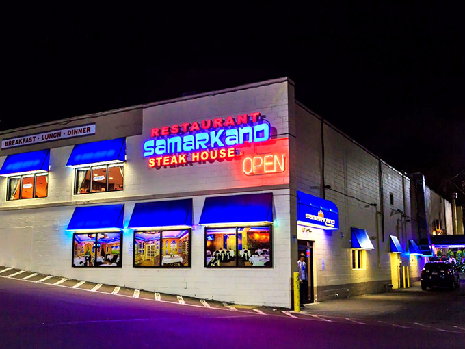 The neon glow of Samarkand's sign cuts through the night like a beacon for hungry souls. This unassuming exterior hides culinary treasures within. 