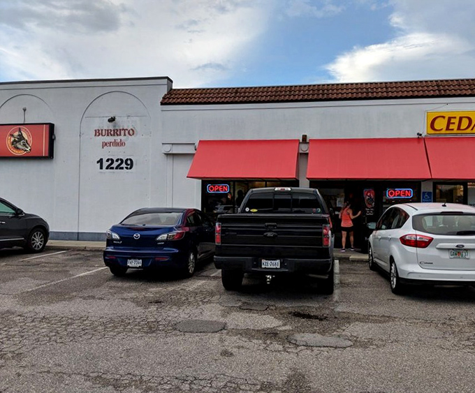 The unassuming storefront that launched a thousand road trips. Like finding a diamond in a strip mall, Burrito Perdido's exterior promises culinary treasures within.