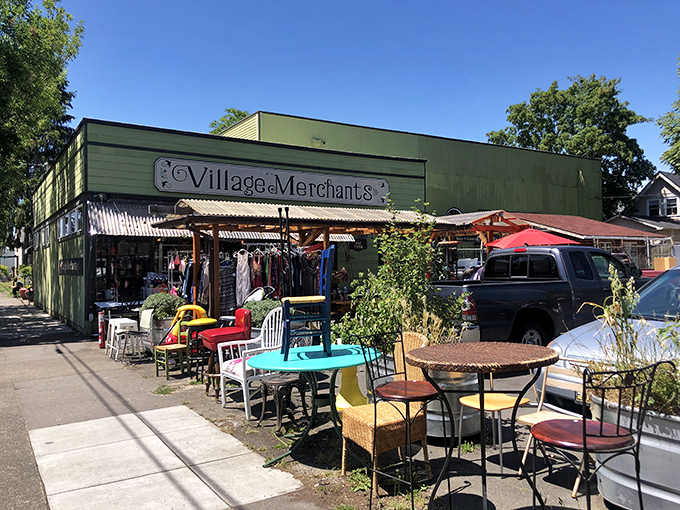 The green facade of Village Merchants beckons like a portal to treasure-hunting paradise, with sidewalk displays offering a tantalizing preview of the wonders within.