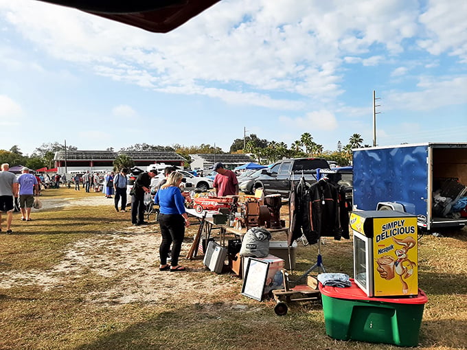 Under Florida's brilliant blue sky, treasure hunters navigate a maze of possibilities. The morning hustle at Sarasota Swap Meet promises discoveries waiting just around the corner.