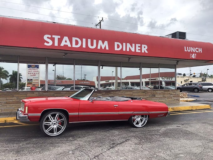 The iconic red awning of Stadium Diner stands as a beacon of breakfast hope for hungry Miamians seeking salvation from sad cereal.