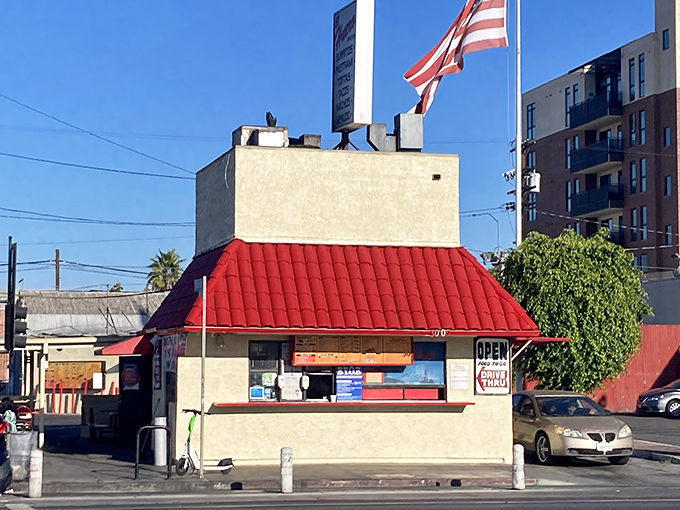 The iconic red-roofed sanctuary of flavor flies its flag proudly. This unassuming drive-thru holds more culinary treasures than buildings ten times its size.
