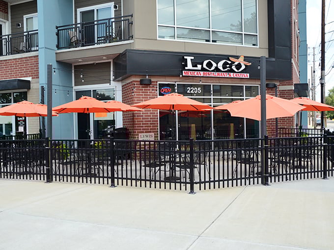 Those vibrant orange umbrellas on the patio aren't just for show—they're beacons calling you to Fall Creek Place's most flavorful corner.