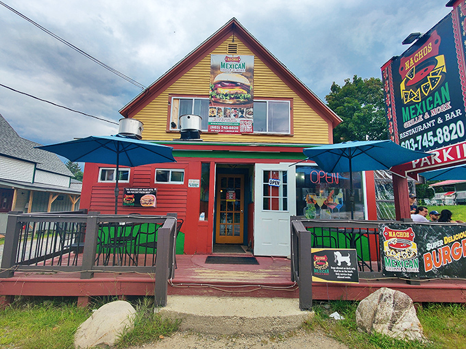 The yellow and red exterior of Nachos Mexican Bar and Grill stands out like a sombrero at a ski lodge, beckoning hungry travelers with its vibrant charm.