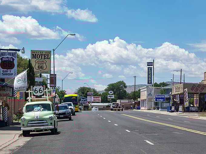 Main Street Seligman stretches before you like a living museum, where classic Americana meets desert sky in a perfect postcard of nostalgia.