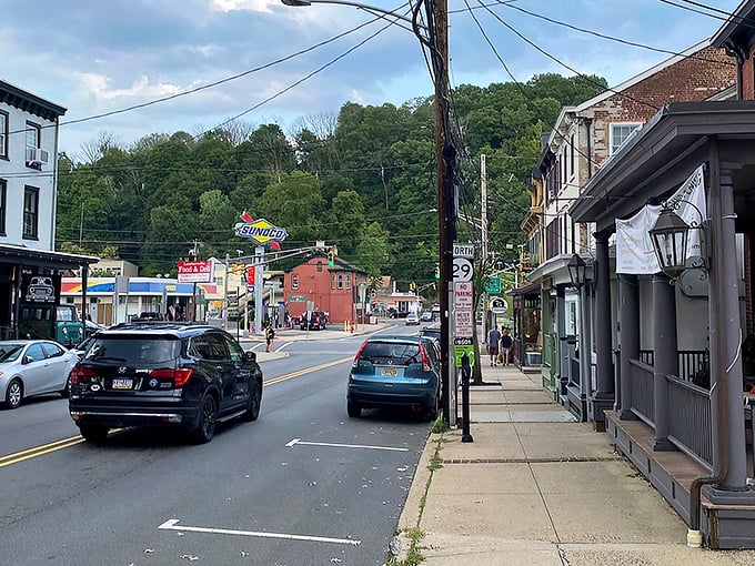Bridge Street buzzes with small-town charm while the colorful "Lambertville" banner welcomes visitors to this riverside gem.