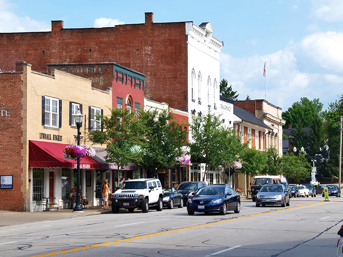 Brick facades and colorful awnings line Main Street, where small-town charm meets architectural character in a scene straight from a Hallmark movie.