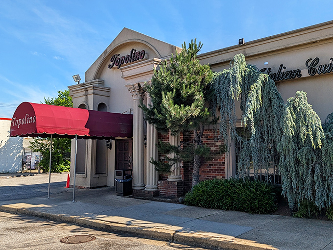 The unassuming exterior of Topolino hides culinary treasures within, like finding a Rolex in a paper bag. That red awning practically winks at you. 