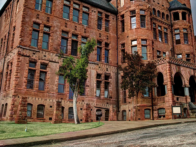 The imposing red brick facade of Preston Castle stands as a magnificent time capsule, its Romanesque revival architecture creating an unexpected European silhouette against California's golden foothills.