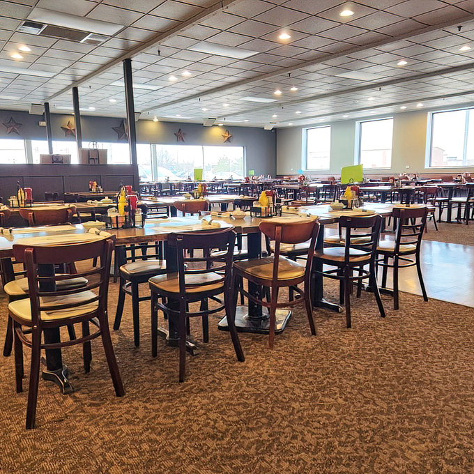 The dining room's clean lines and ample seating invite you to settle in. Those star decorations on the wall remind you where you are&mdash;at a five-star experience.