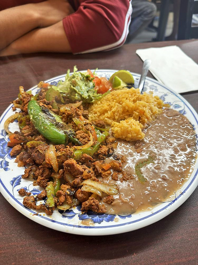 The adobada plate arrives like a color wheel of Mexican flavors&mdash;spiced meat, golden rice, and creamy beans creating a harmony that makes taste buds sing.