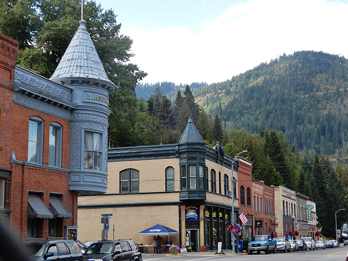 Victorian turrets and ornate cornices give Wallace's streetscape a storybook quality, with mountains providing a dramatic backdrop to this architectural showcase.