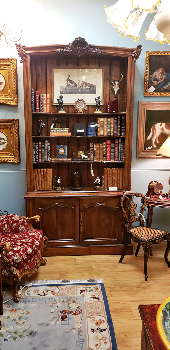 This bookcase isn't selling just books&mdash;it's offering the complete gentleman's study experience, leather-bound wisdom included.