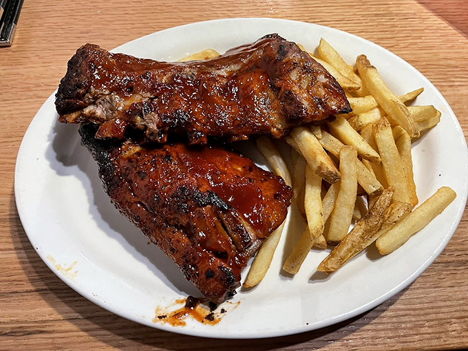 These BBQ ribs have clearly been introduced to heat and smoke for so long they've developed a beautiful relationship with both.