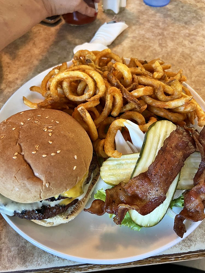 This isn't just a burger&mdash;it's an architectural masterpiece of beef, bacon, and cheese that requires both hands and several napkins.