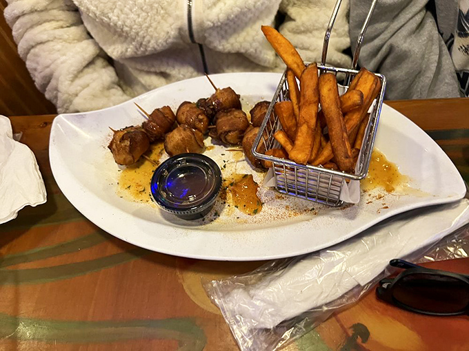 This isn't just a plate of bacon-wrapped delights&mdash;it's proof that sometimes the best things in life come in small packages with a side of sweet potato fries.