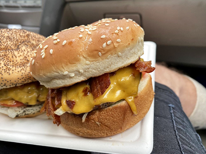 Layer upon layer of burger perfection—sesame-seeded bun, crisp lettuce, juicy tomato, and bacon that should be in the Crispy Hall of Fame.
