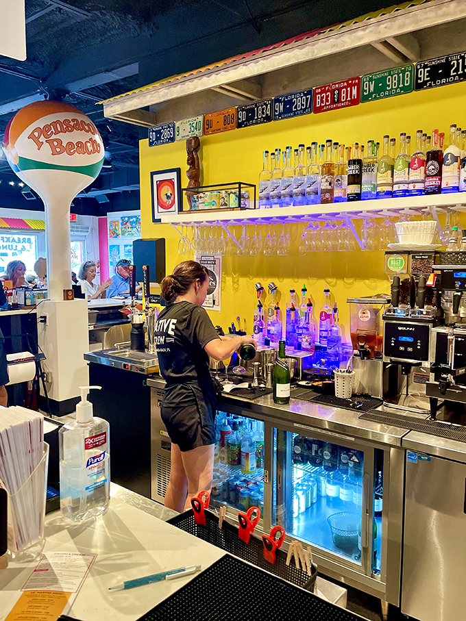 The bar area pops with Pensacola Beach pride and enough bottles to make you forget you came for breakfast in the first place.