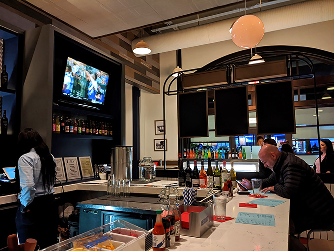 The bar area invites you to pull up a stool and stay awhile. Sports on TV, bottles gleaming on shelves, and friendly faces make it hard to leave.