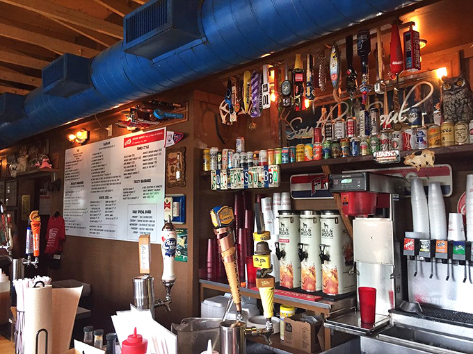 Where BBQ magic happens. The wall of pennants and memorabilia tells stories of victories—both on the field and in the smoker.