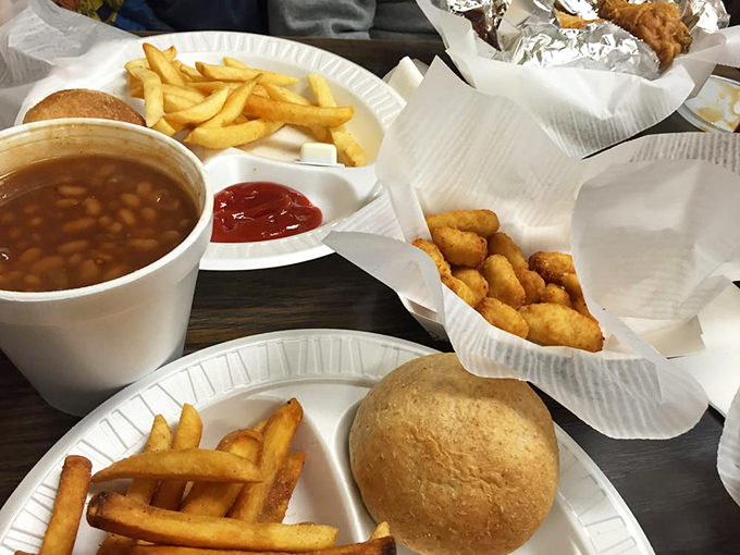 The spread tells the whole story &ndash; fresh rolls, golden fries, baked beans, and more, creating the perfect supporting cast for the star proteins.