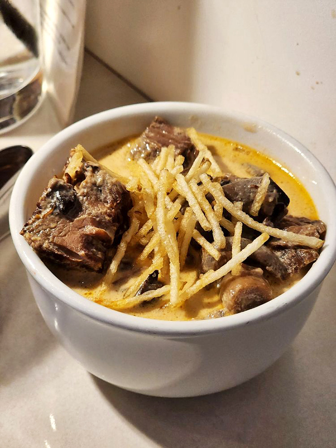 Comfort food with a Brazilian passport. This beef stroganoff topped with crispy potato straws is like a warm hug from someone else's grandmother.