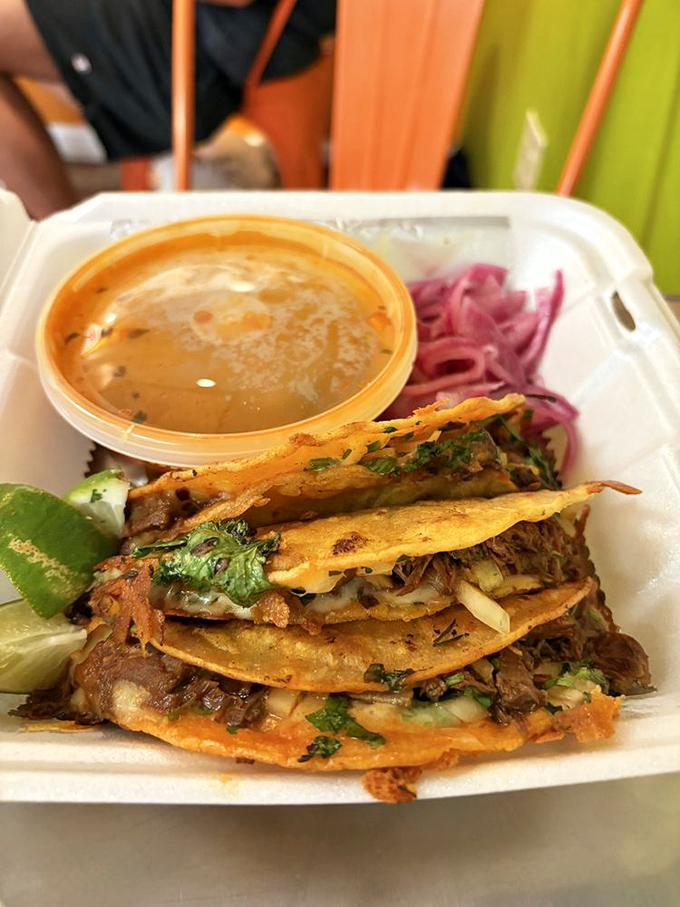 Birria tacos: where crispy meets juicy. The accompanying consomm&eacute; isn't just a dip&mdash;it's a flavor transformation waiting to happen.