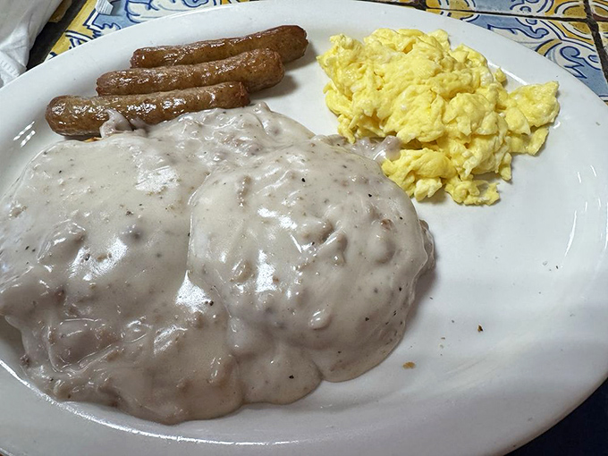 Biscuits and gravy with home fries and an egg – the breakfast equivalent of a warm hug from your favorite aunt who never counted calories.
