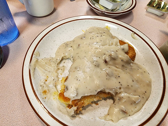 Biscuits smothered in peppery gravy&mdash;a Southern classic executed with respect. Comfort food that hugs you from the inside out.