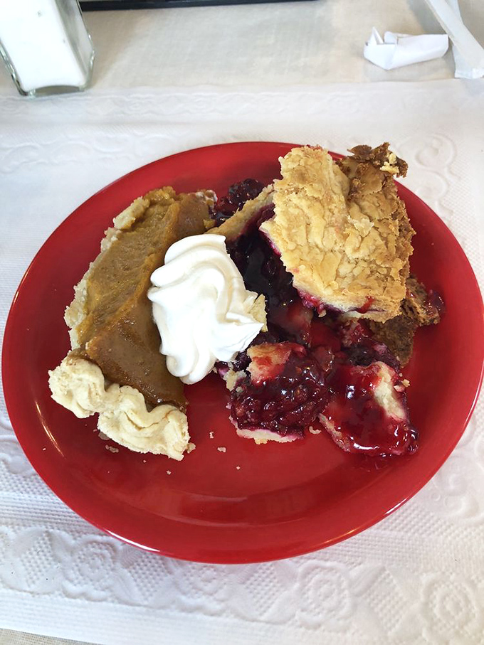 Two slices of pie that prove indecision can be delicious. Berry and pumpkin create a seasonal summit meeting that demands a dollop of whipped cream.