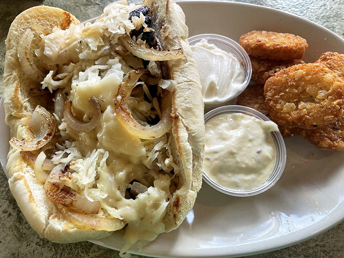 The bratwurst sandwich comes loaded with sauerkraut and melted cheese—a delicious nod to German Village's heritage that satisfies to the last bite.