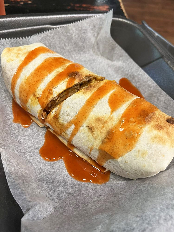 Breakfast burrito perfection: when the sauce drizzles just right, you know you've found morning meal nirvana wrapped in a tortilla.
