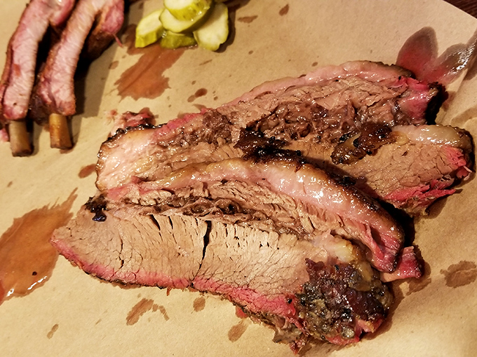 Brisket sliced to perfection&mdash;revealing that telltale pink smoke ring that separates the barbecue masters from the pretenders.