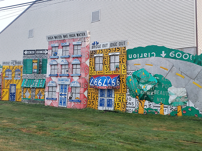 Neighborhood watch, sign-style! These colorful building facades create a miniature Main Street from materials that once lined actual streets&mdash;meta-architecture at its finest.