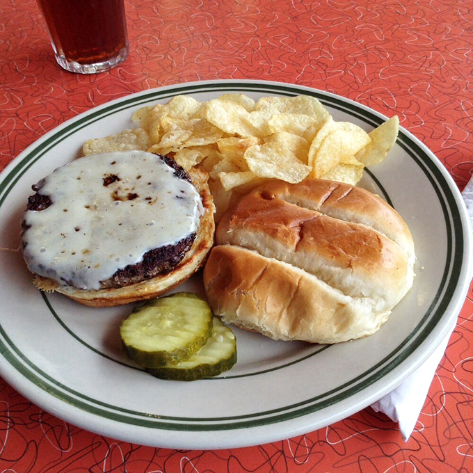 A burger that doesn't need Instagram filters to look good. That melted cheese blanket is tucking in a beef patty that's lived a fulfilling life.