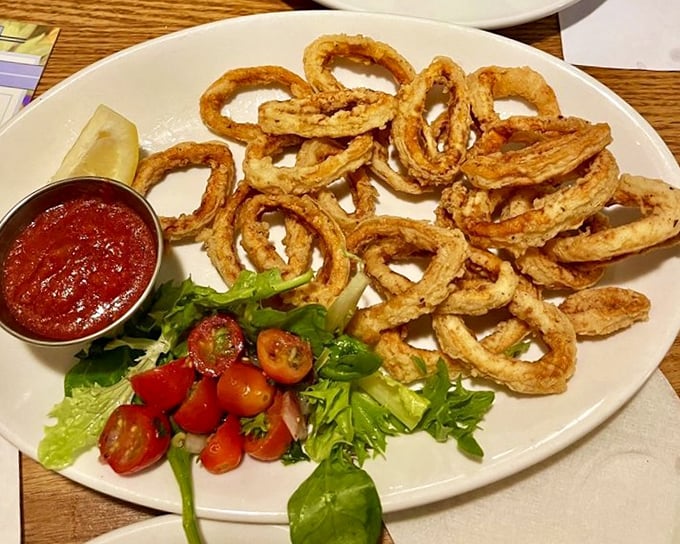 Calamari rings fried to golden perfection&mdash;crunchy on the outside, tender within. The marinara sauce stands by, ready for its dipping debut.
